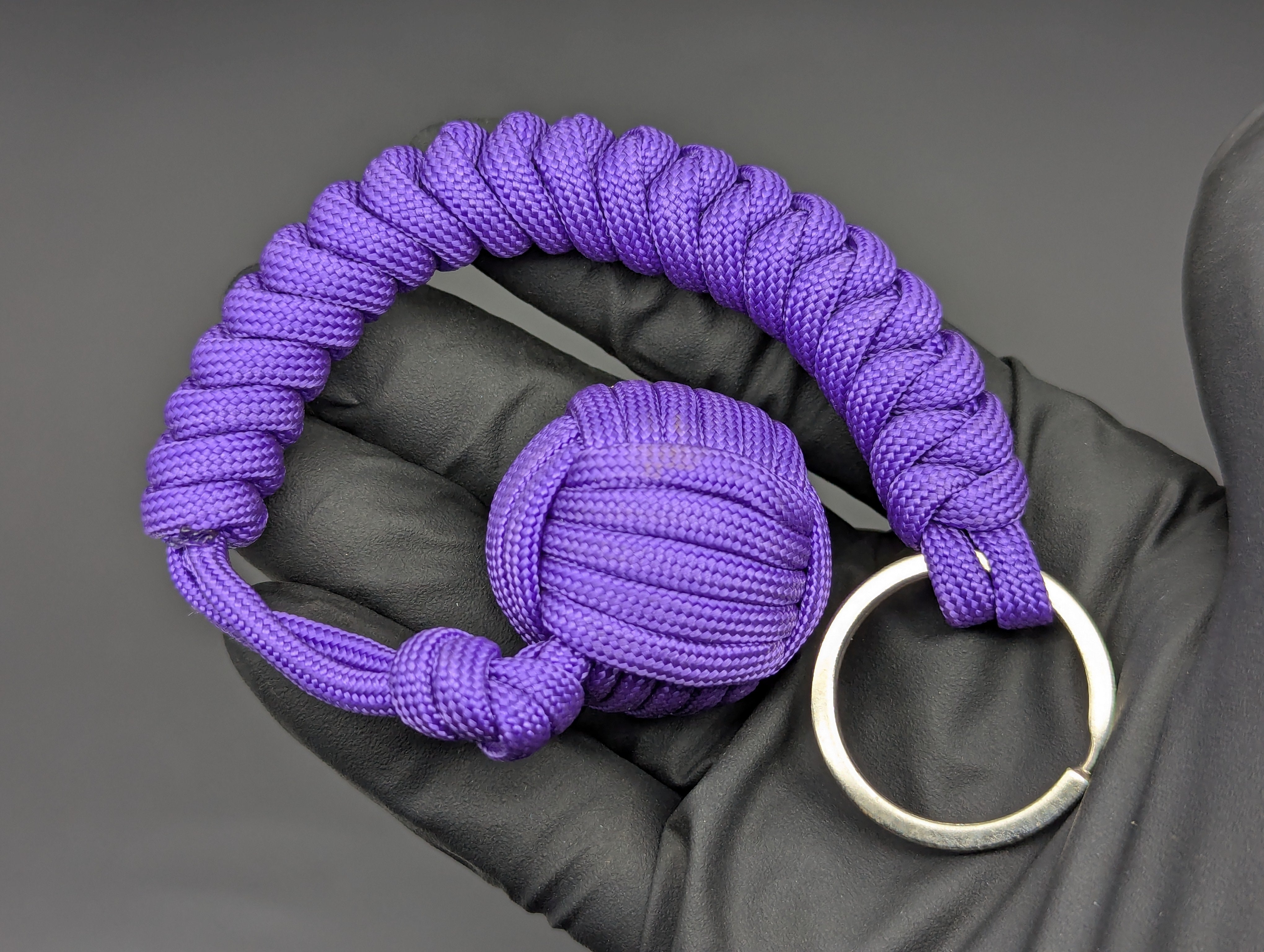 SOLID PURPLE 550 PARACORD SELF DEFENSE MONKEY FIST – LIGHTNING OTF KNIVES