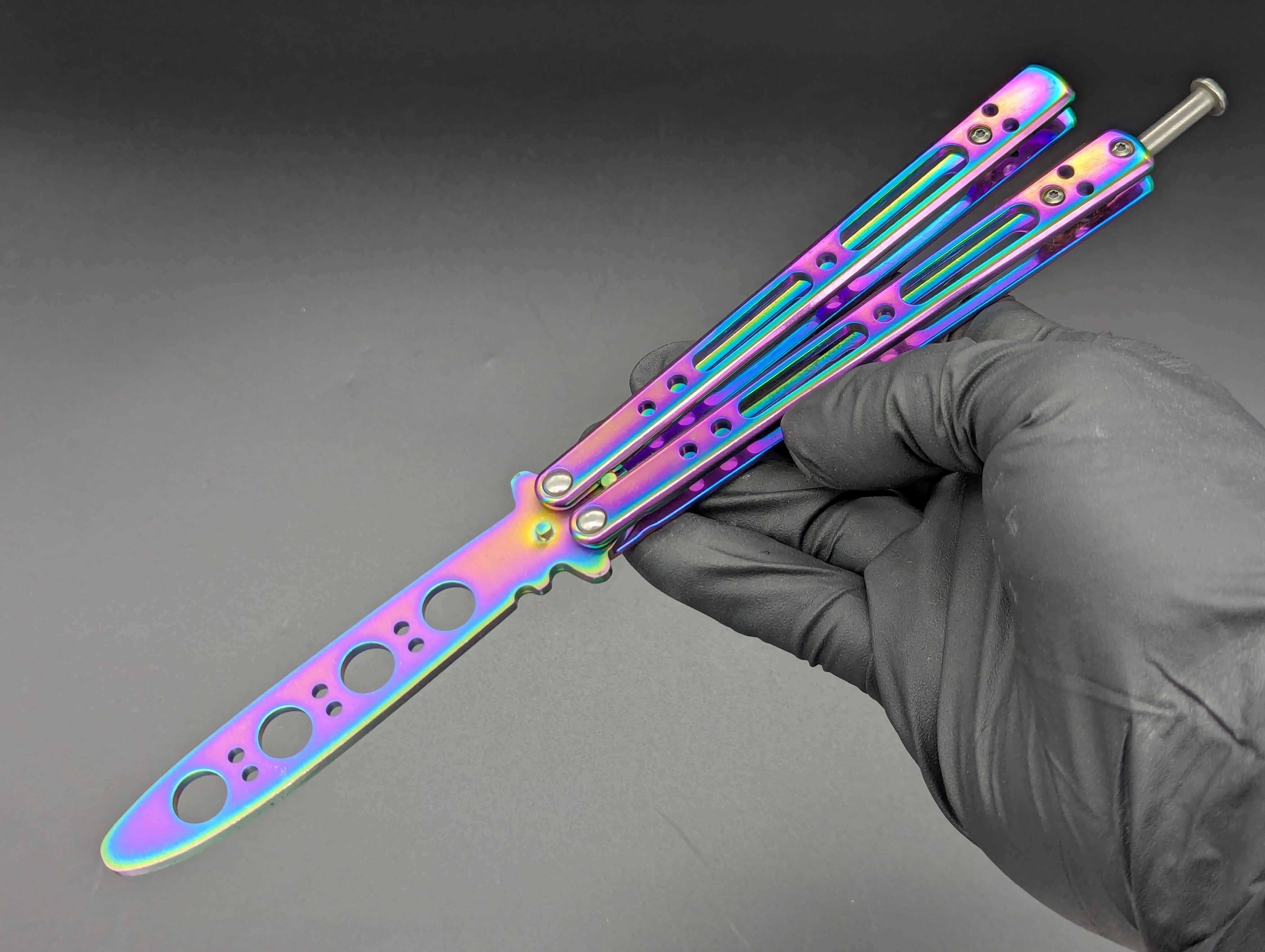 RAINBOW Ti SKELETONIZED BALISONG TRAINER – LIGHTNING OTF KNIVES